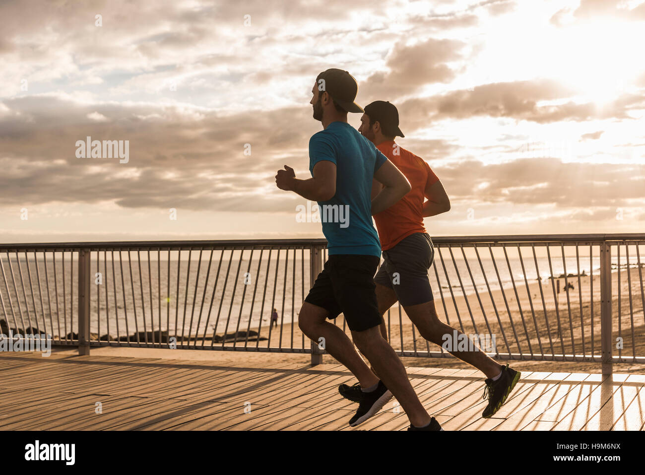 USA, New York City, two men running on Coney Island Stock Photo - Alamy