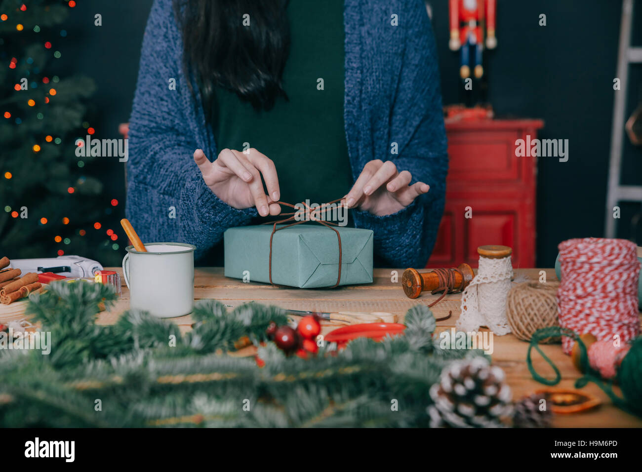 Woman wrapping christmas gifts Stock Photo - Alamy