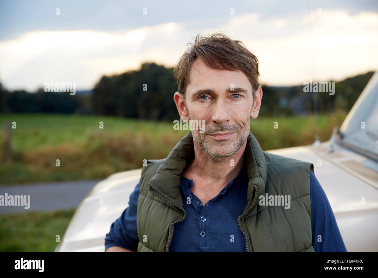Portrait of man at pick up truck Stock Photo - Alamy