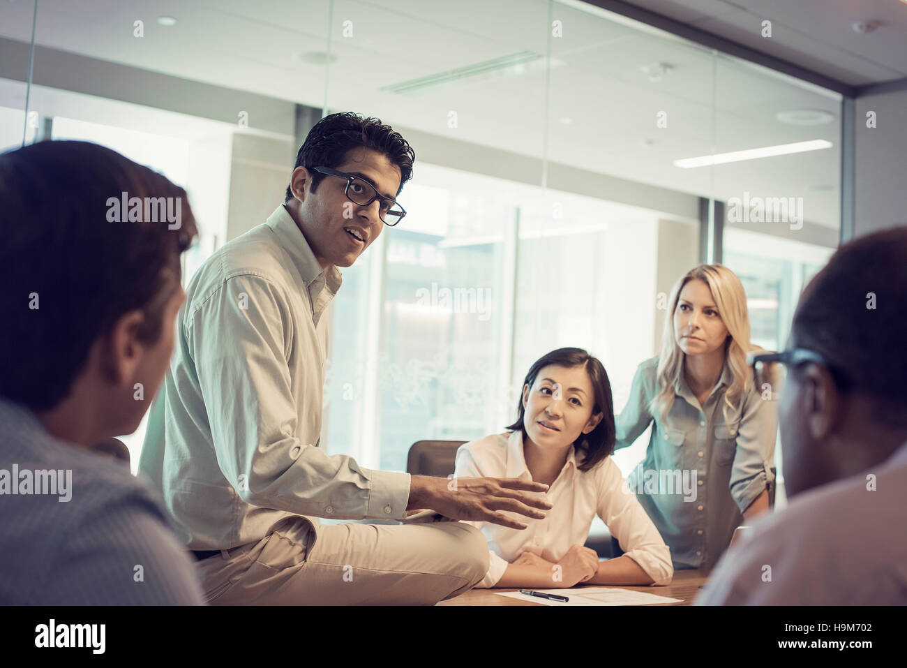 Business people in meeting having interesting discussion Stock Photo ...