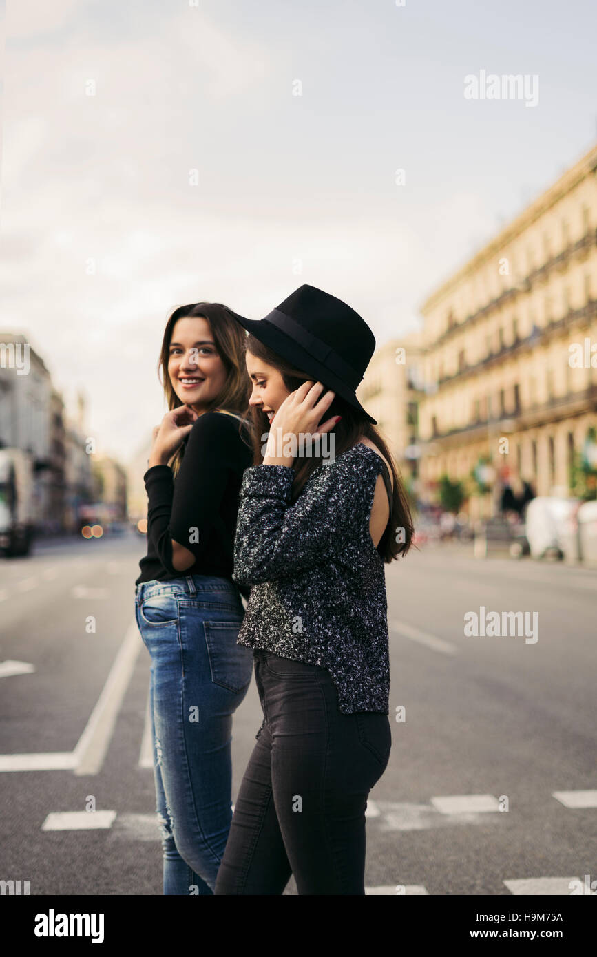 Two best friends crossing street Stock Photo - Alamy