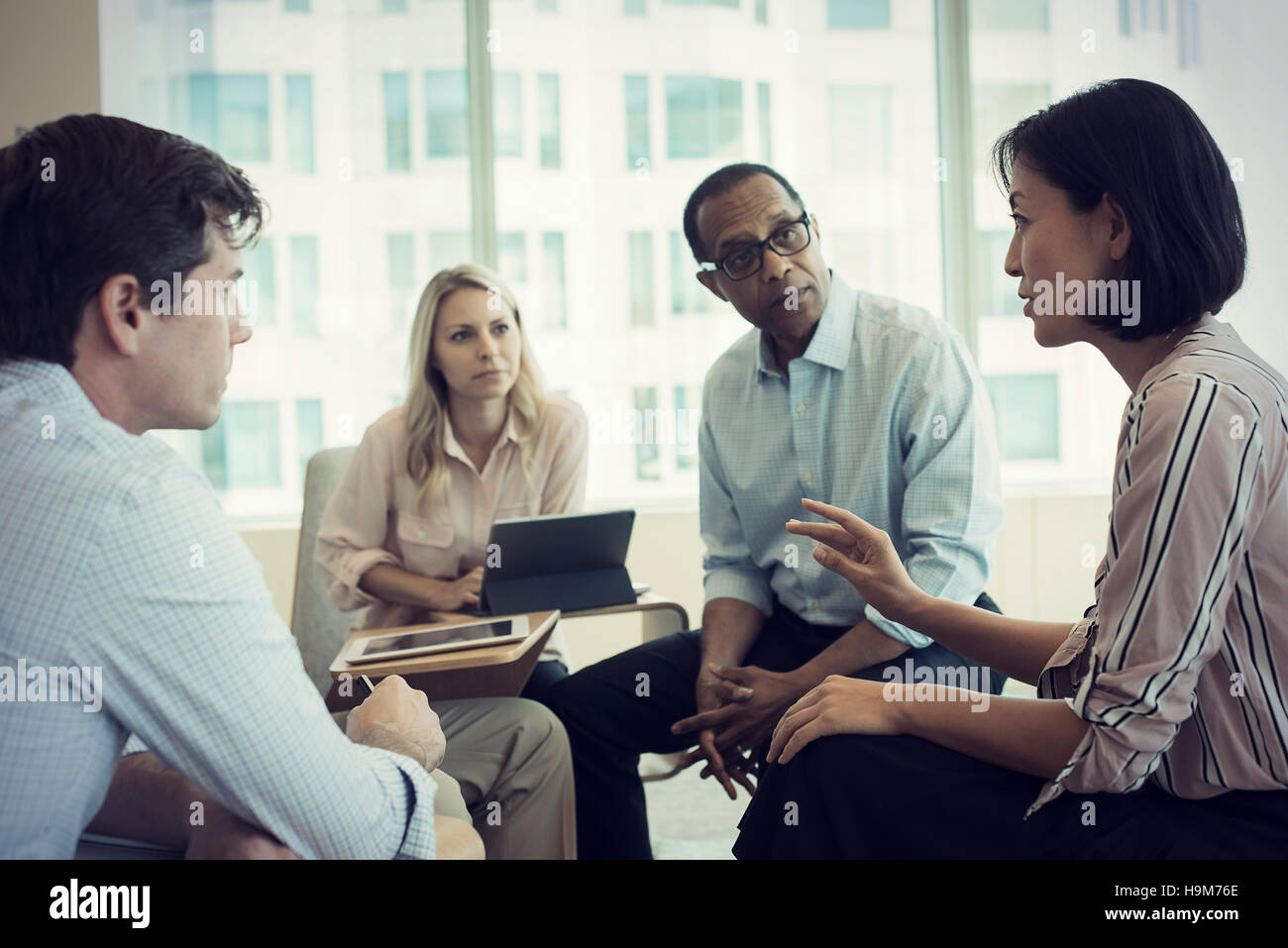 Business people in meeting having interesting discussion Stock Photo ...