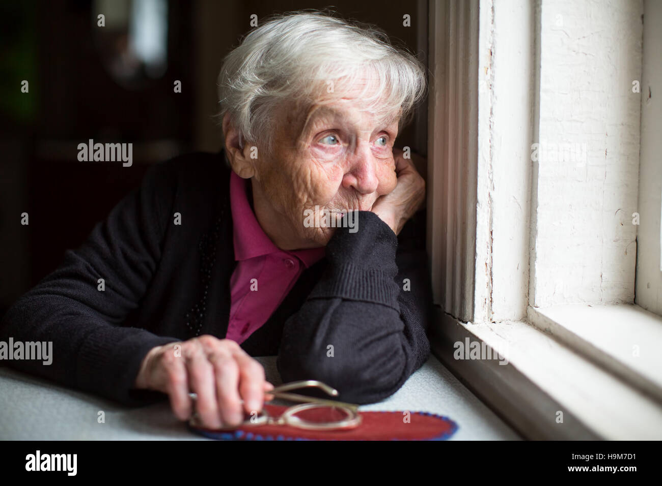 Grandma looking out window hi-res stock photography and images - Alamy