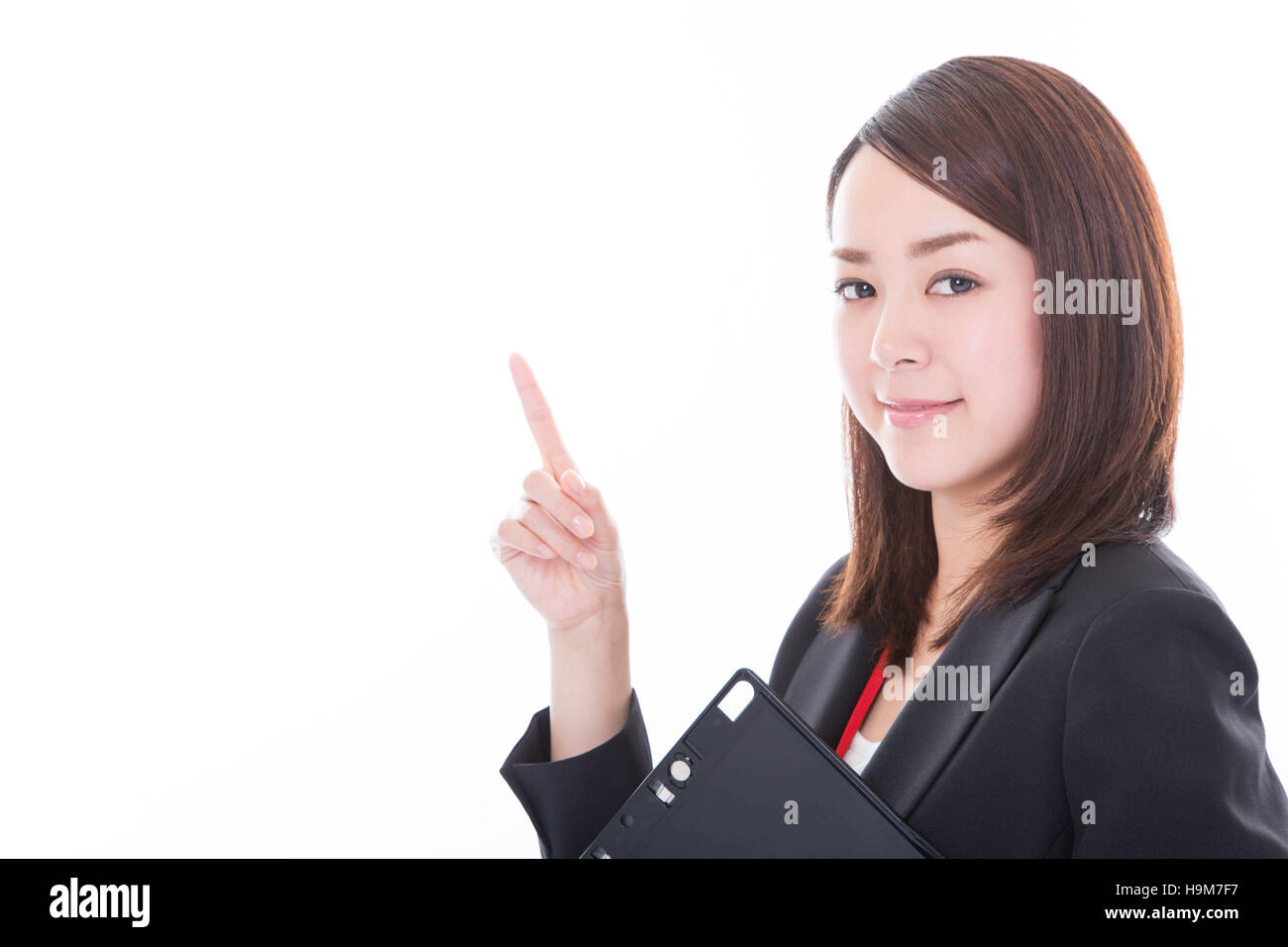 Business woman pointing Stock Photo - Alamy