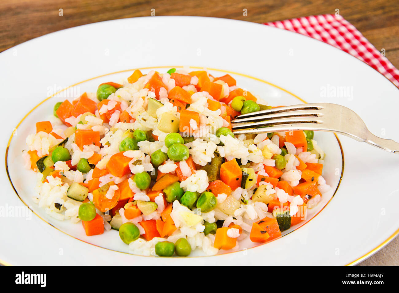 Risotto with Vegetables, Carrots and Peas. Studio Photo Stock Photo - Alamy