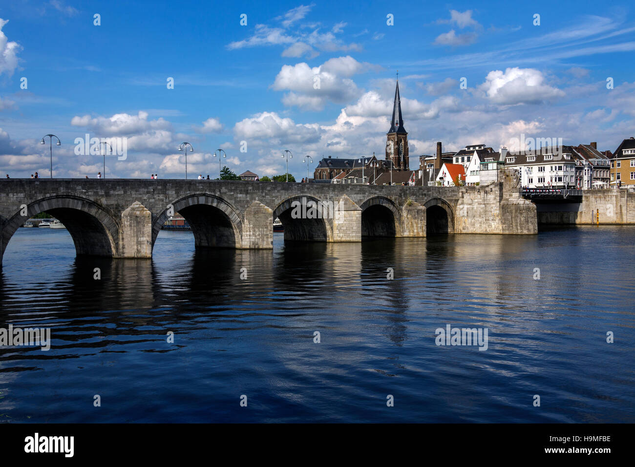 View of Maastricht city centre with its medieval bridge over the Meuse ...