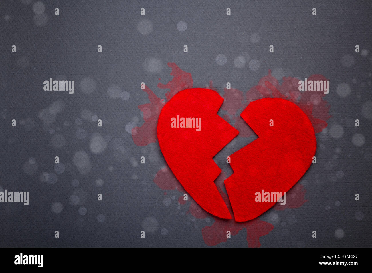 Felt red broken heart Stock Photo - Alamy