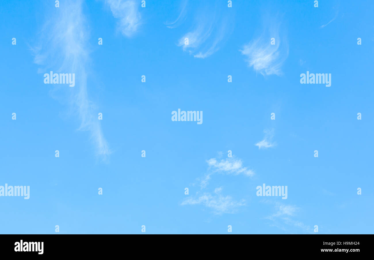 Mostly clear sky with small nice white cloud Stock Photo - Alamy