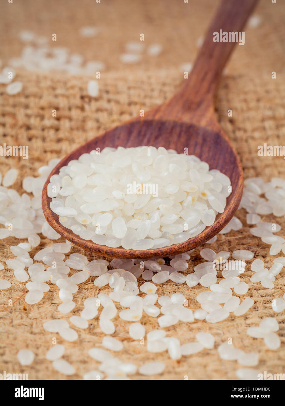 Whole grain traditional japanese rice in wooden spoon with hemp Stock ...
