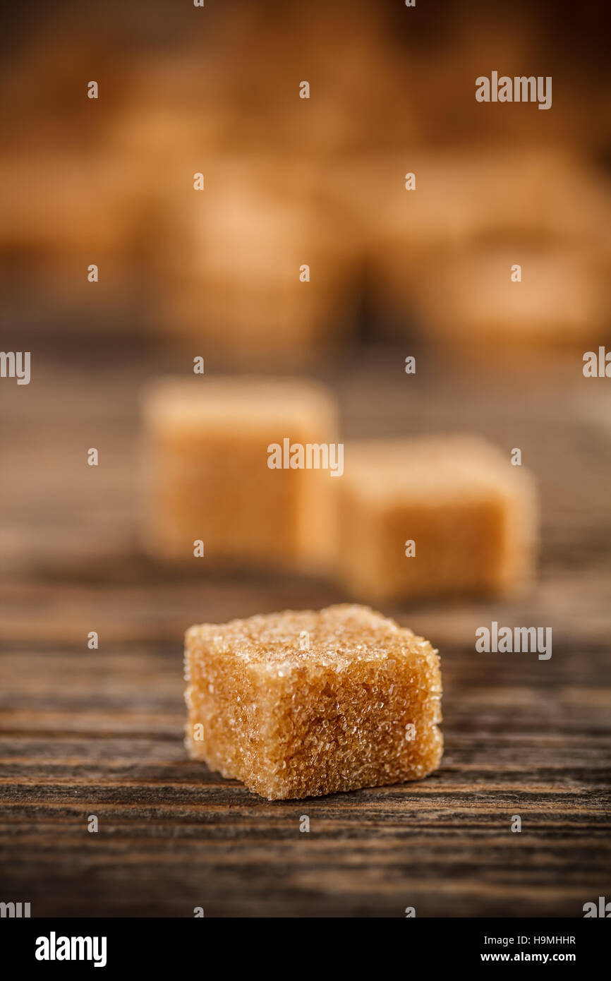 Brown lump sugar Stock Photo - Alamy