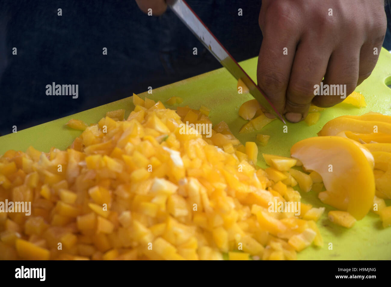 Chef chopping yellow capsicum, Pune, India, Pune, India Stock Photo - Alamy