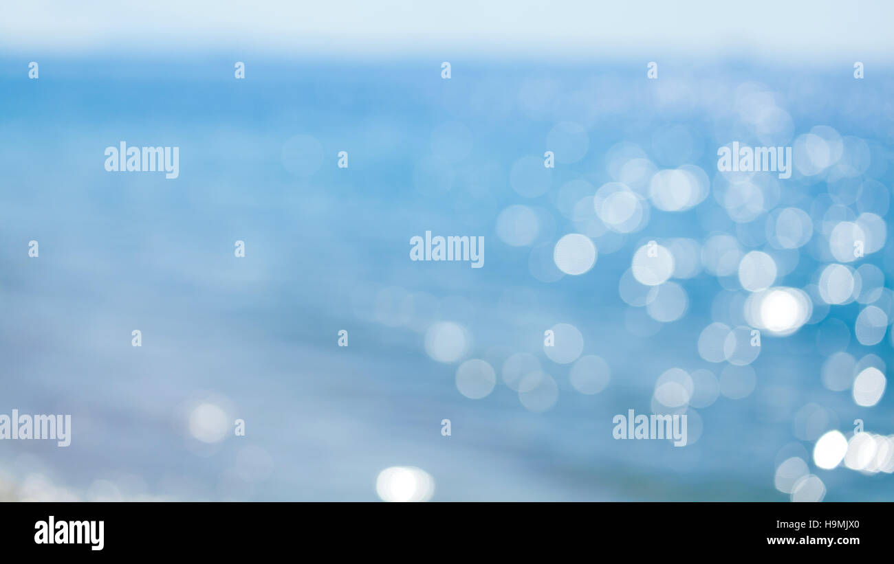 Lights reflection bokeh on sea wave for background Stock Photo - Alamy