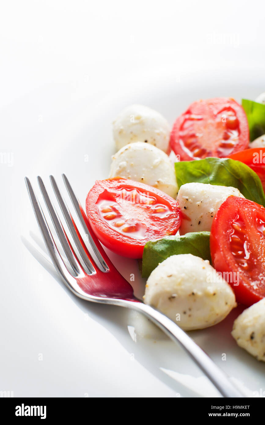 Fresh caprese salad on white background close up Stock Photo - Alamy