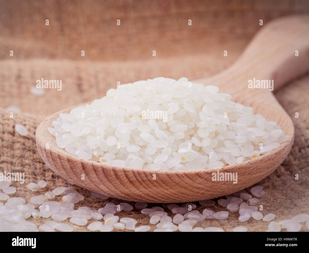 Whole grain traditional japanese rice in wooden spoon with hemp Stock ...
