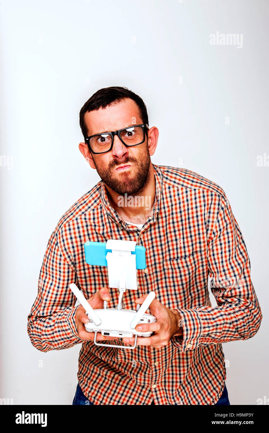 Man holding drone controler, isolated over white background mad Stock ...