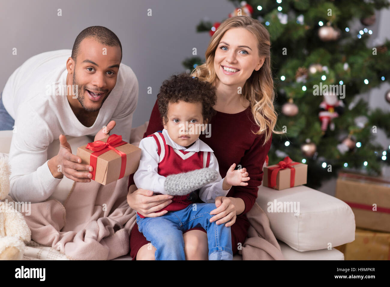 Positive nice family looking at you Stock Photo - Alamy