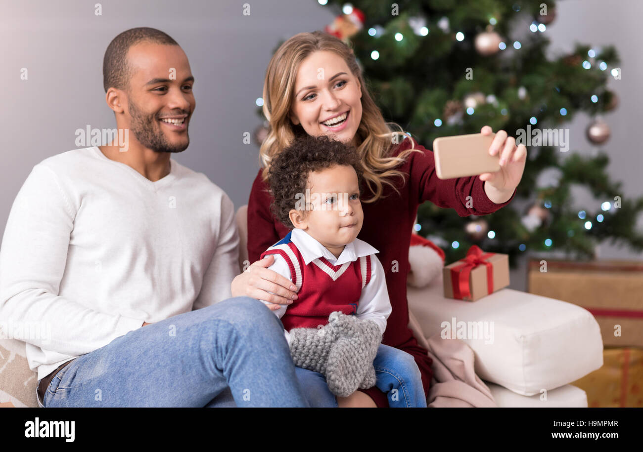 Nice happy family posing for a photo Stock Photo - Alamy