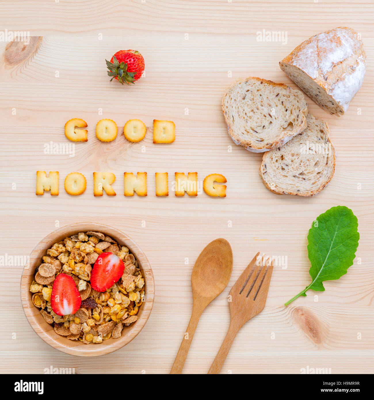 Good morning concept - Cereal in wooden bowl with strawberry and Stock ...