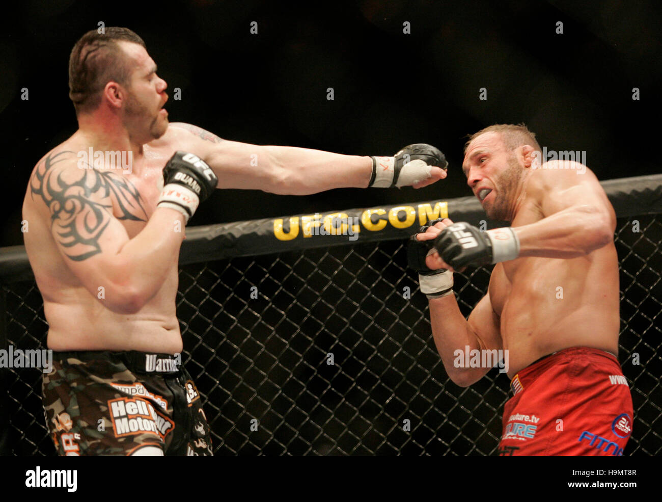 Tim Sylvia, left, in his fight against Randy Couture during Ultimate ...