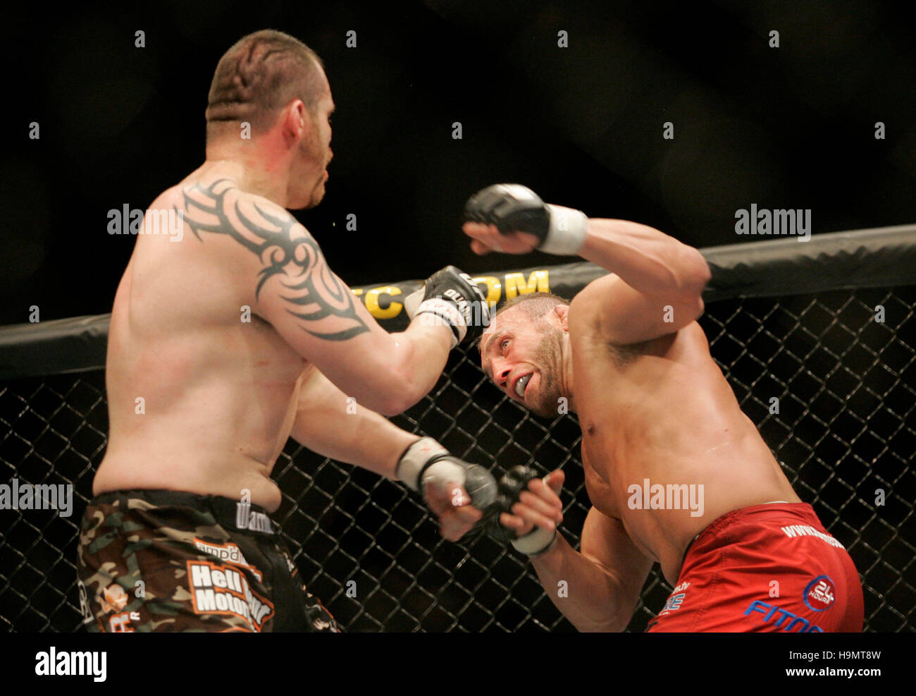 Randy Couture, right, fights Tim Sylvia during Ultimate Fighting ...