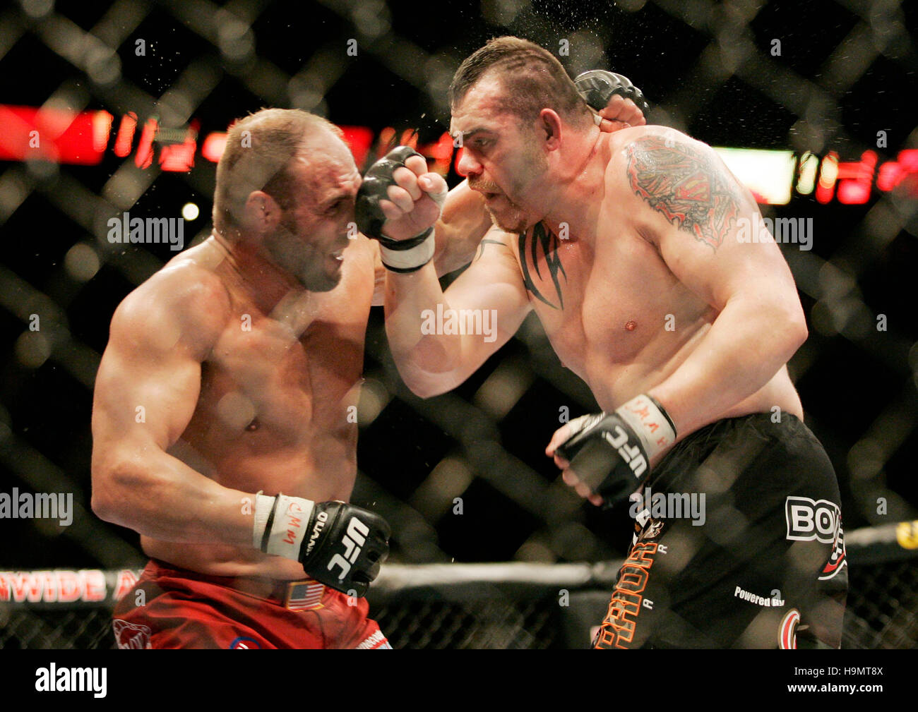 Randy Couture, left, fights Tim Sylvia during Ultimate Fighting ...