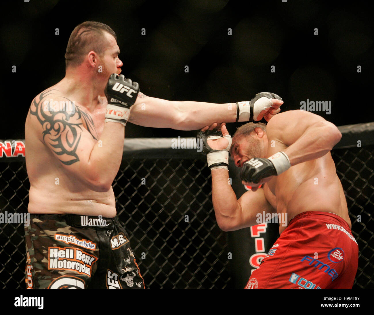 Randy Couture, right, fights Tim Sylvia during Ultimate Fighting ...
