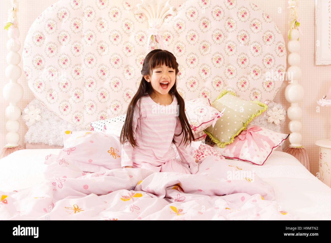 Cute little girl get up Stock Photo - Alamy