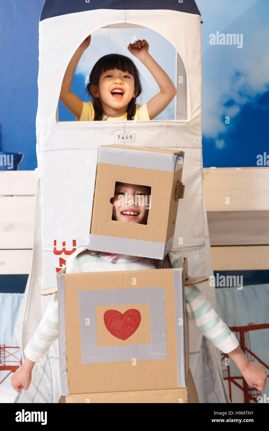 Cute little girl playing with space exploration Stock Photo - Alamy