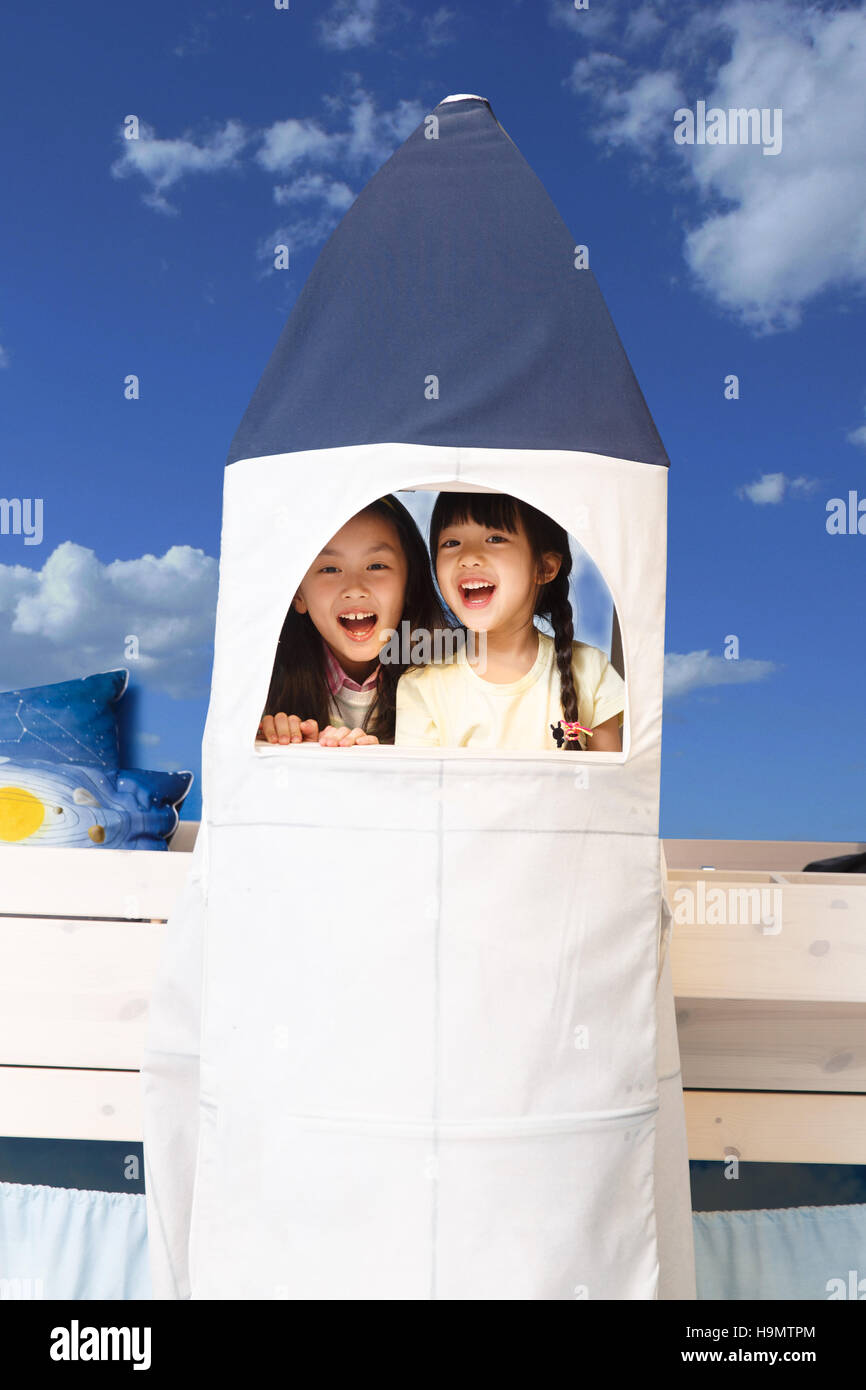 Cute little girl playing with space exploration Stock Photo - Alamy
