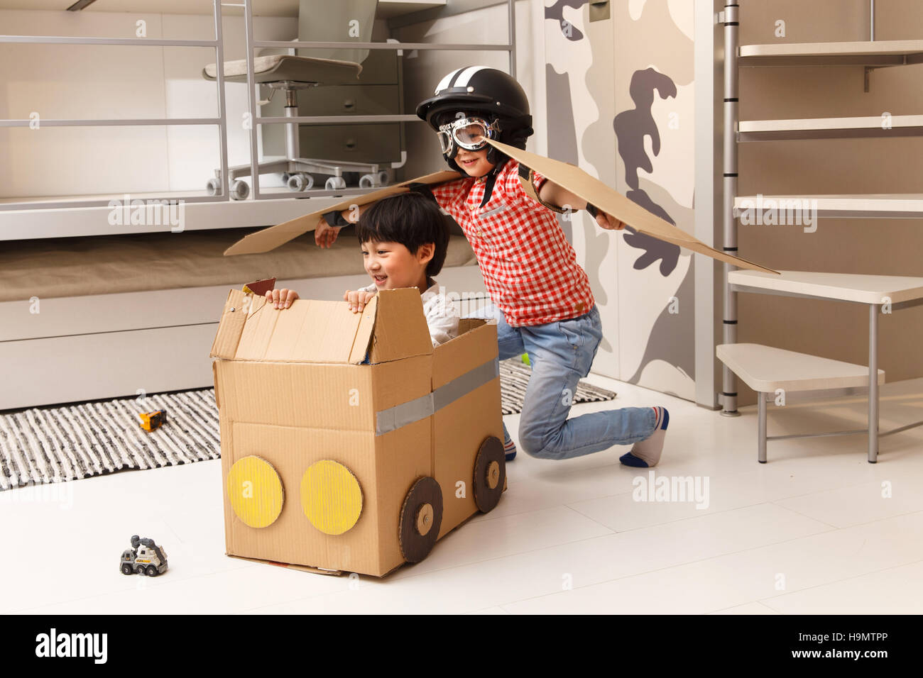 Two brothers play in the bedroom Stock Photo - Alamy