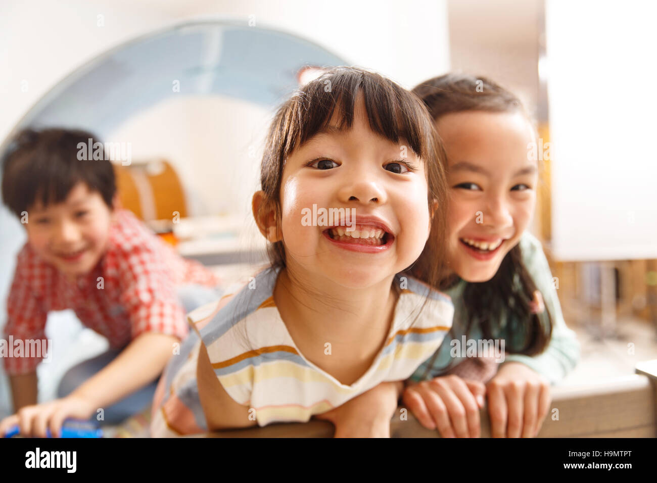 Happy children play on the bed Stock Photo - Alamy