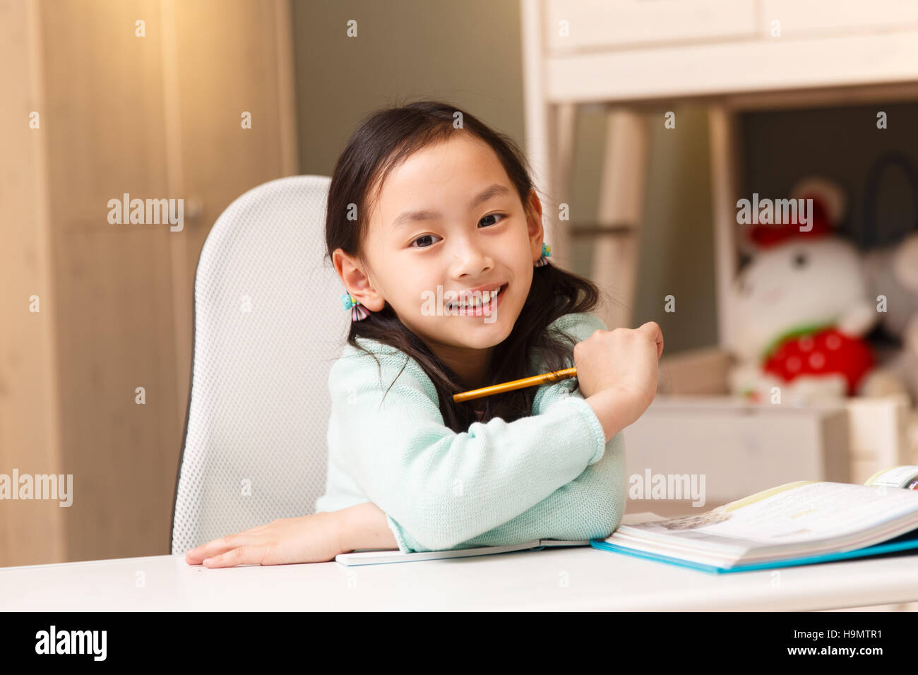 Little girl in learning Stock Photo - Alamy