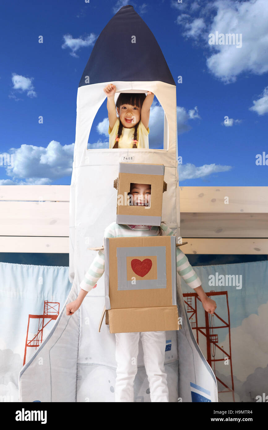 Cute little girl playing with space exploration Stock Photo - Alamy