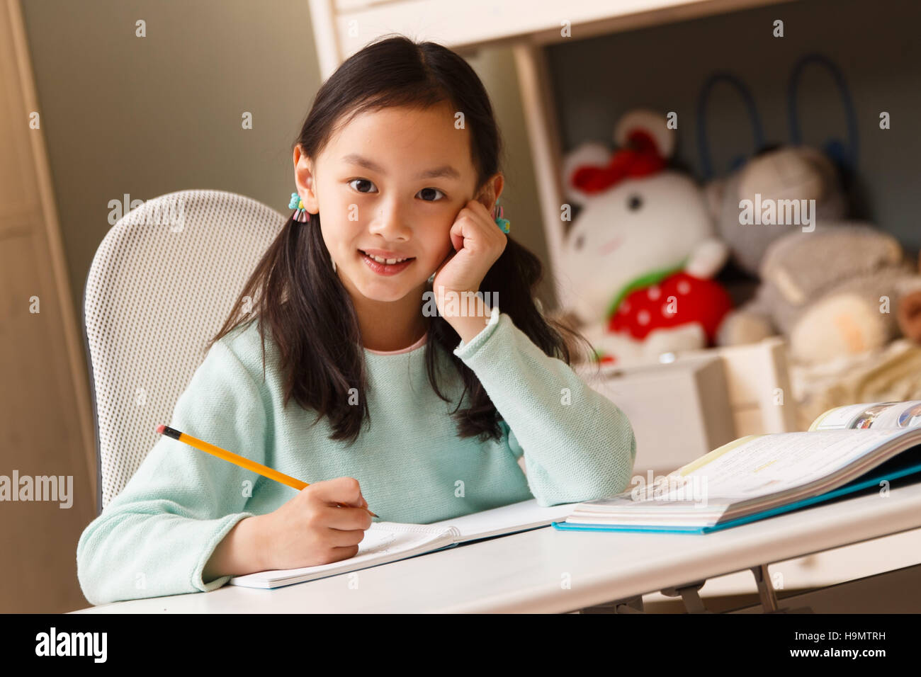 Little girl in learning Stock Photo - Alamy