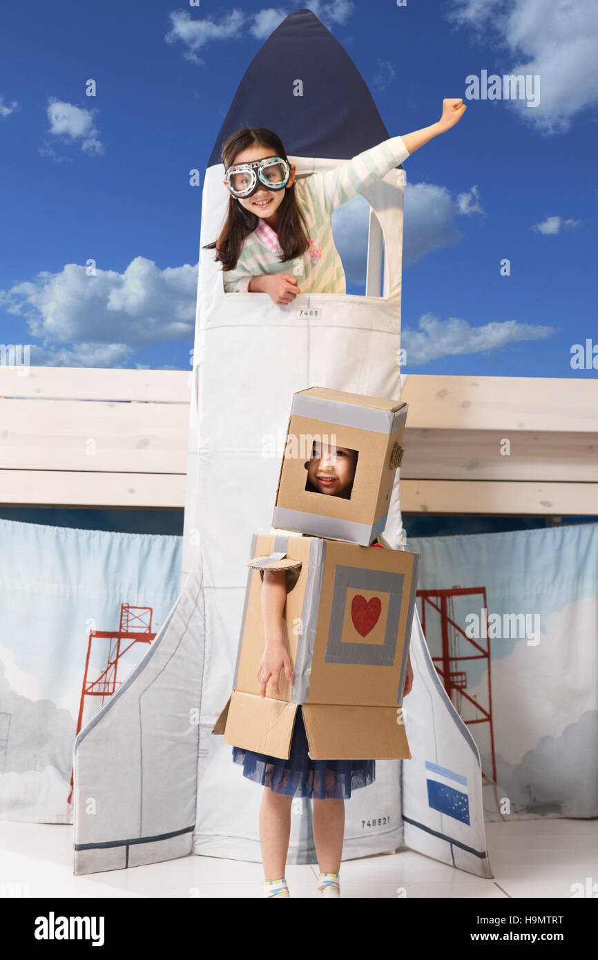 Cute little girl playing with space exploration Stock Photo - Alamy