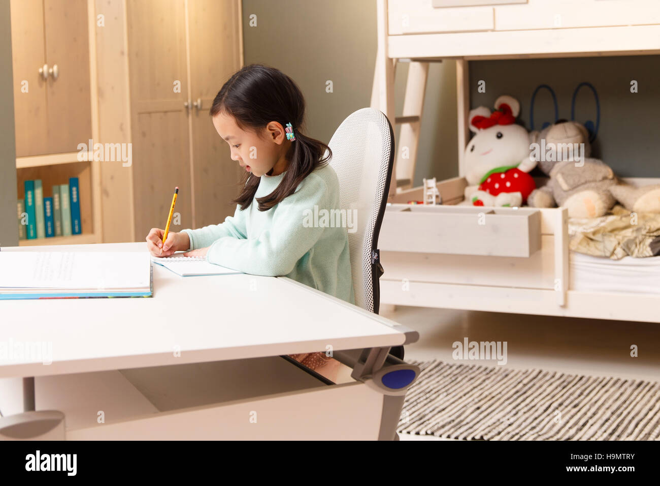 Little girl in learning Stock Photo - Alamy