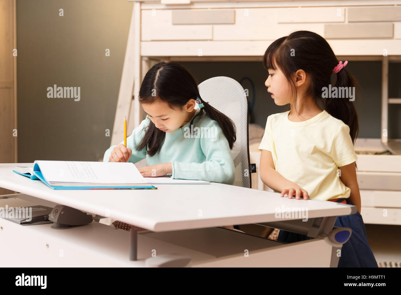 Little girl in learning Stock Photo - Alamy