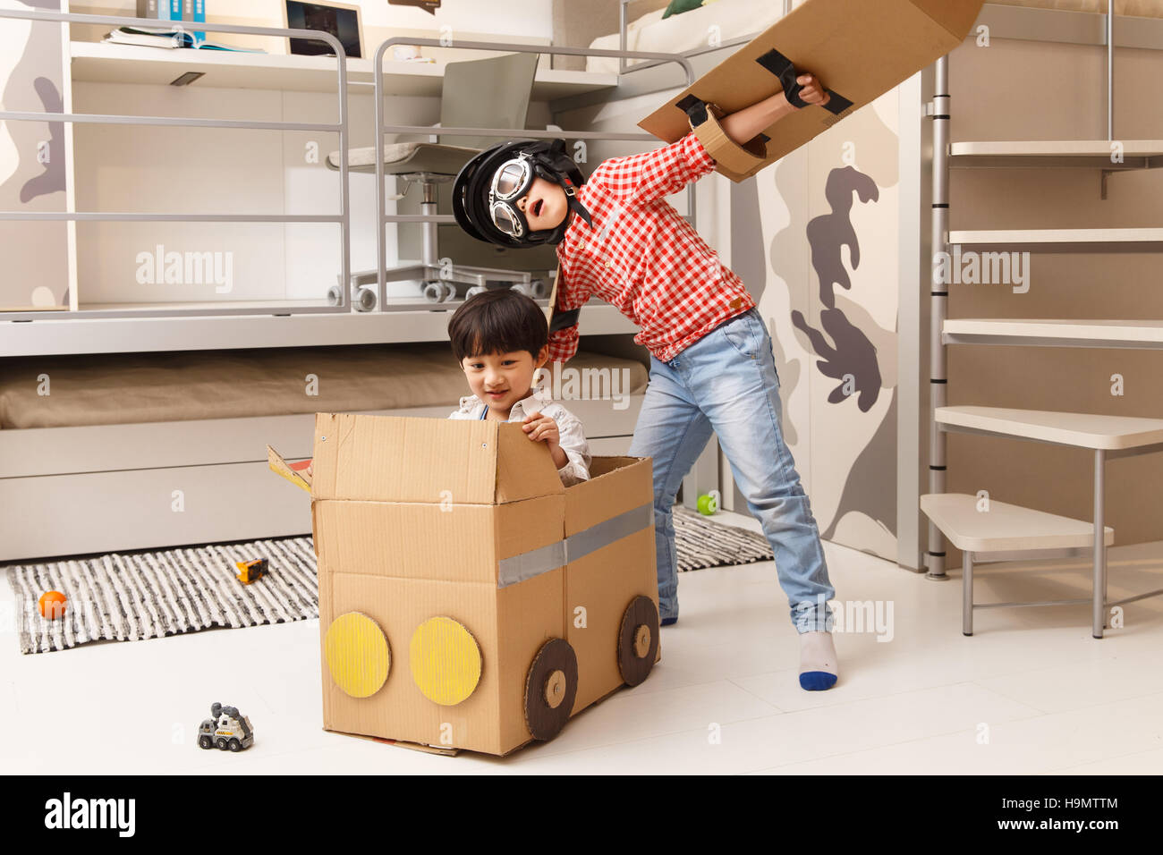 Two brothers play in the bedroom Stock Photo - Alamy
