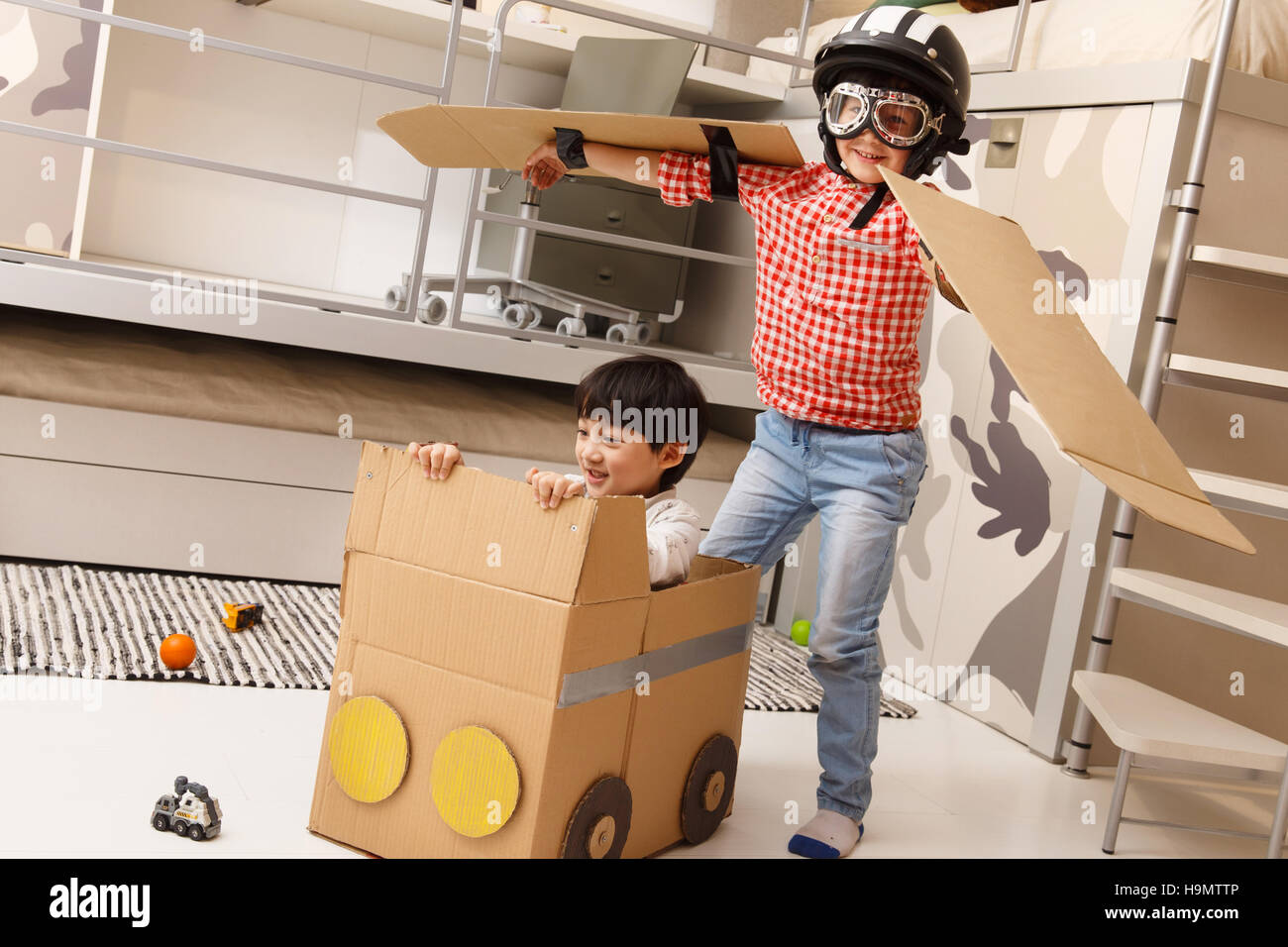 Two brothers play in the bedroom Stock Photo - Alamy