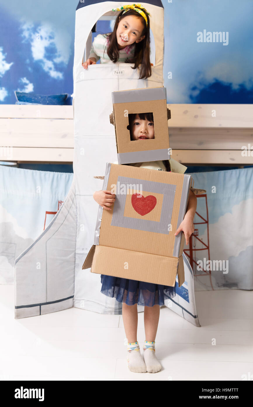Cute little girl playing with space exploration Stock Photo - Alamy