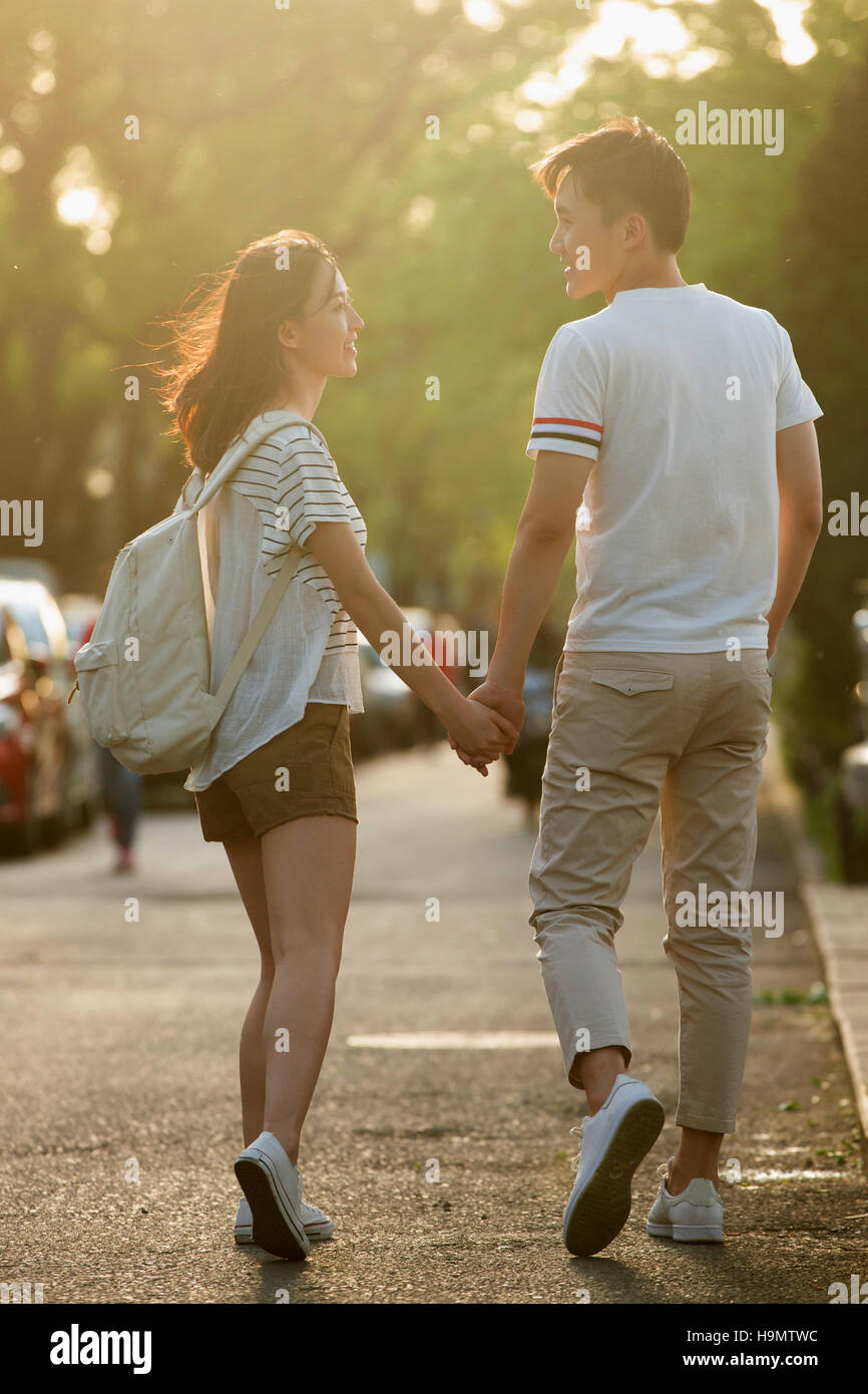 Lovers walking hand in hand hi-res stock photography and images - Alamy