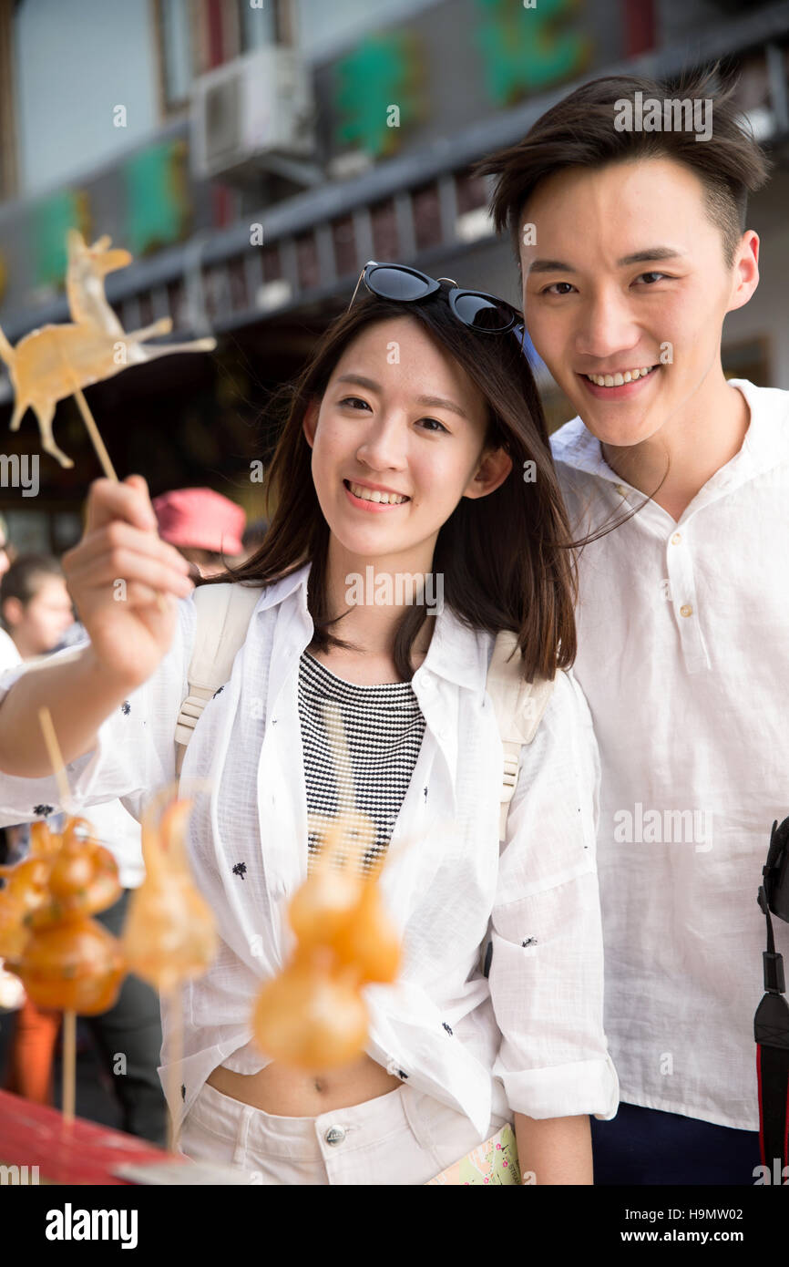 Happy couples see sugar in the street Stock Photo - Alamy