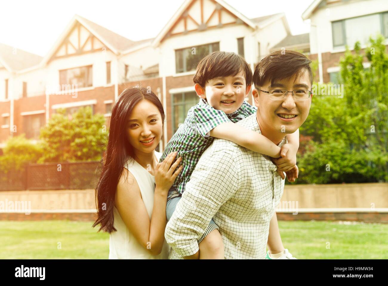 A happy family of three Stock Photo - Alamy