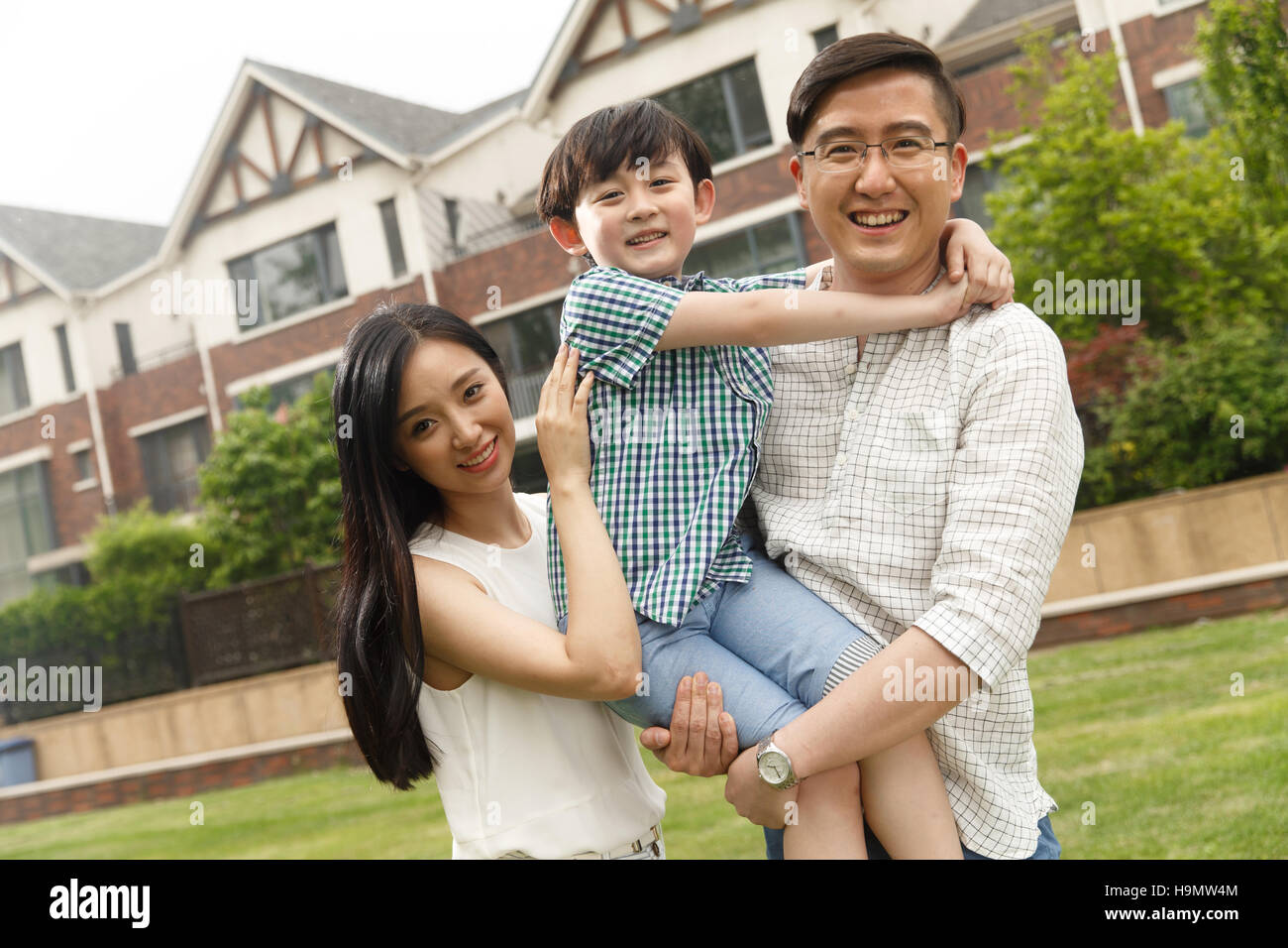 A happy family of three Stock Photo - Alamy