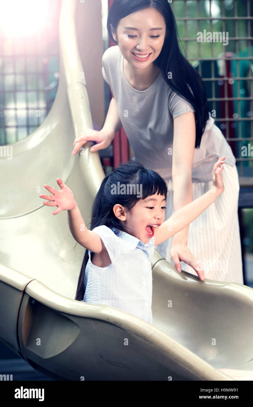 The little girl slide Stock Photo - Alamy