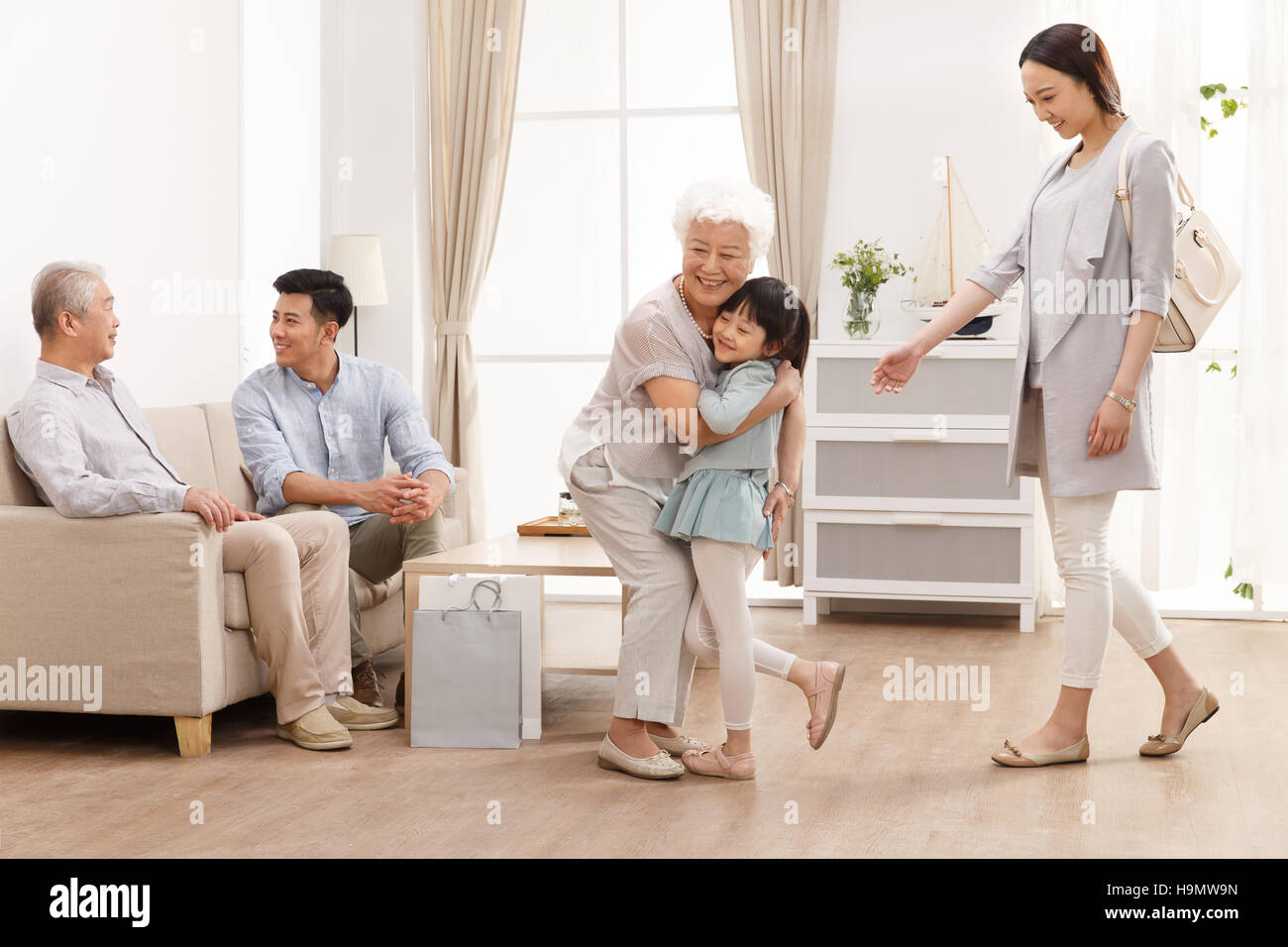 A family of three to go home to visit relatives Stock Photo - Alamy