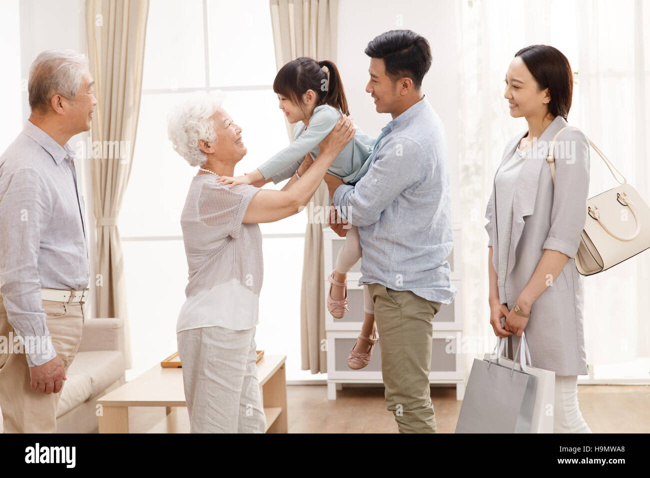 A family of three to go home to visit relatives Stock Photo - Alamy