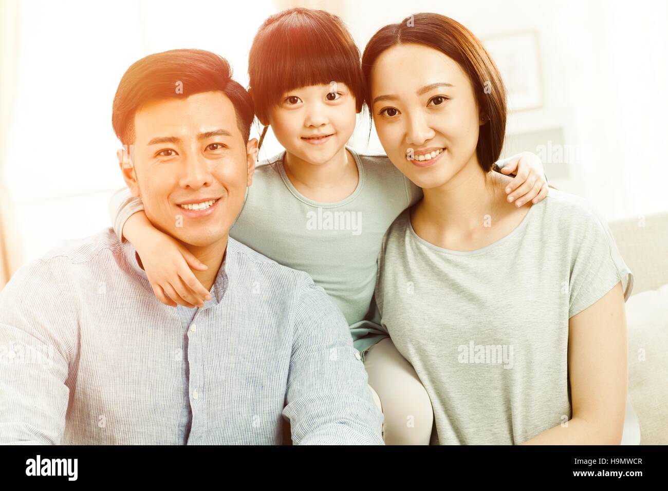 A happy family of three photo Stock Photo - Alamy