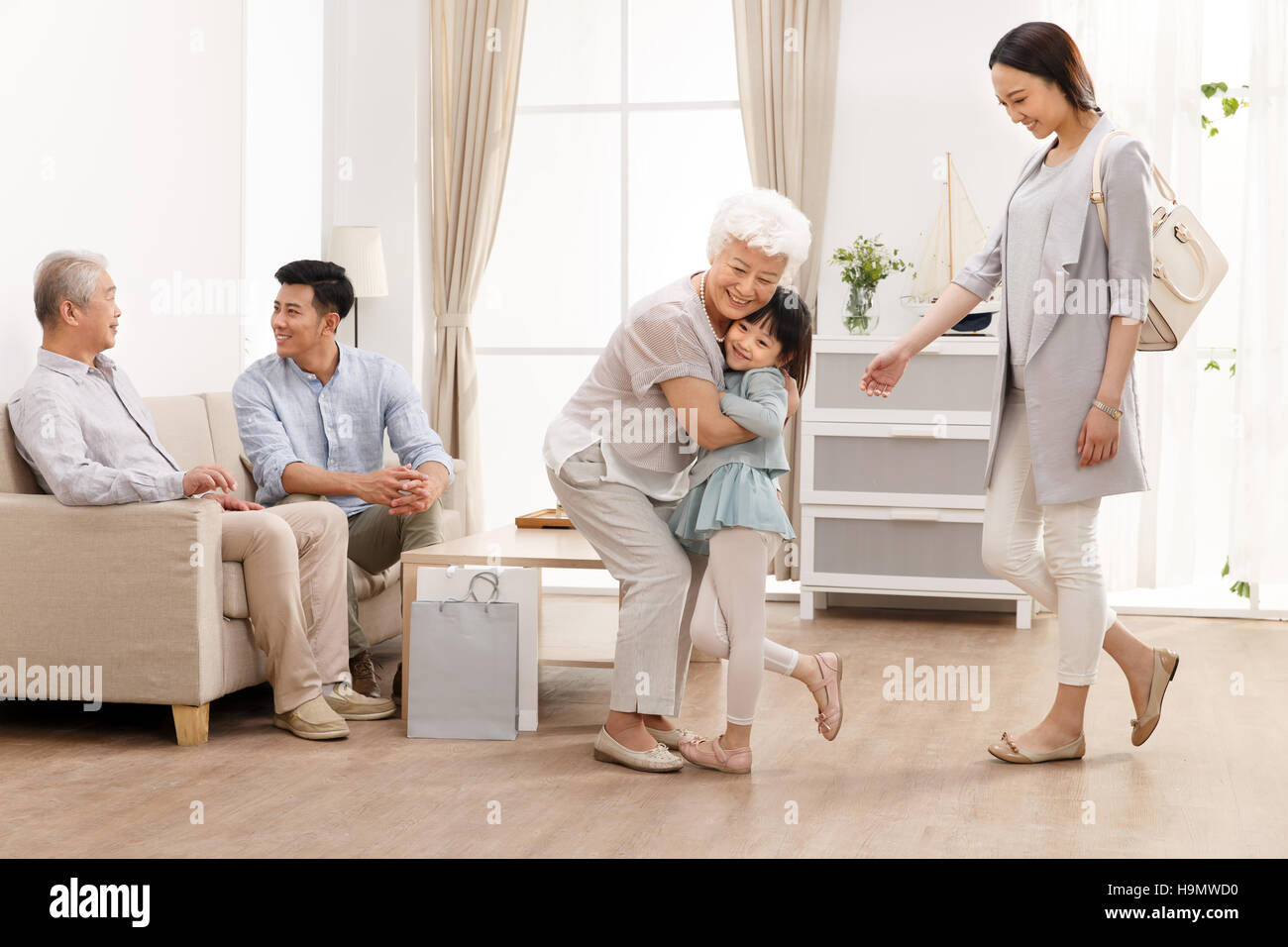 A family of three to go home to visit relatives Stock Photo - Alamy
