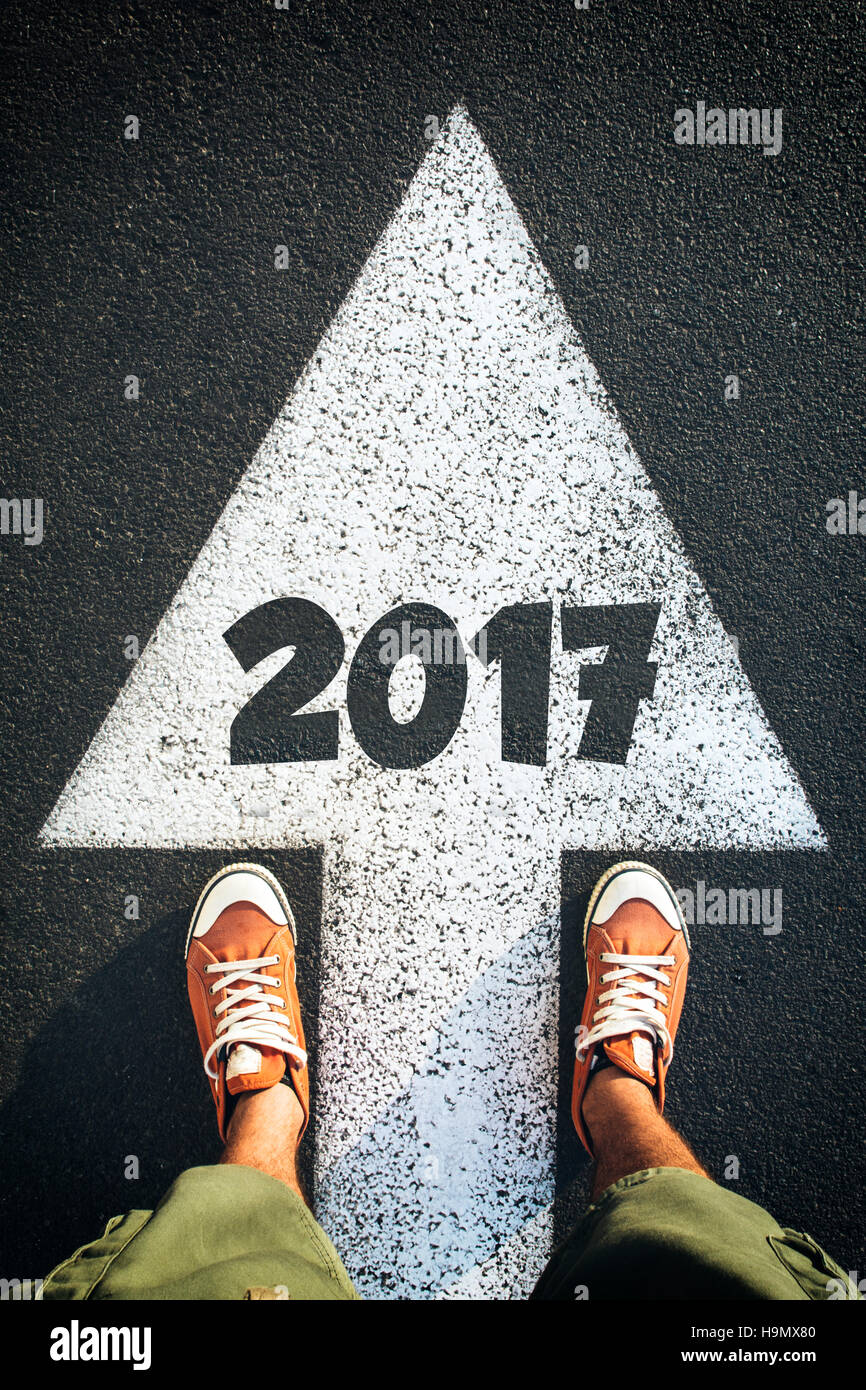Man standing on street arrow sign who showing direction on 2017 Stock ...